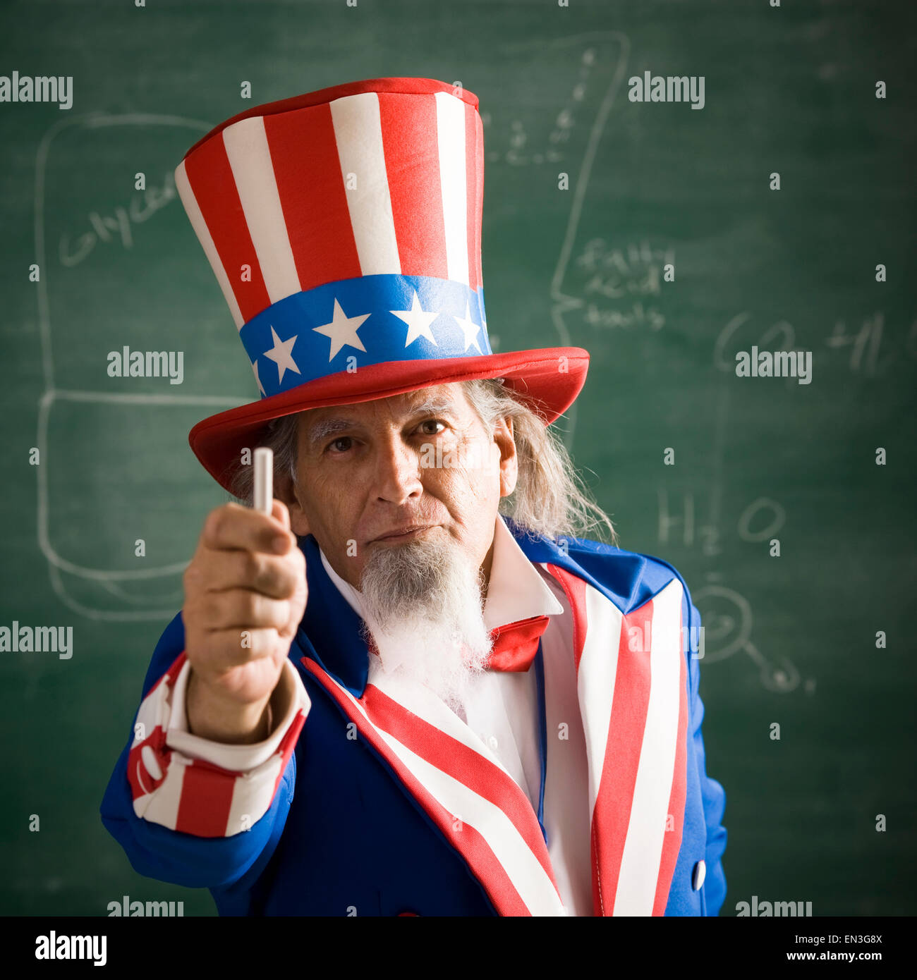 Portrait of Uncle Sam holding chalk stick in classroom Stock Photo - Alamy