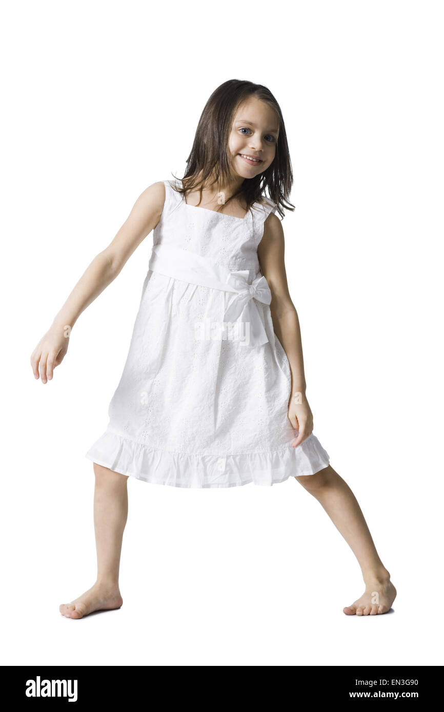 Girl in white dress dancing Stock Photo - Alamy