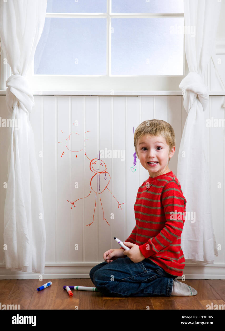little boy drawing on the wall Stock Photo - Alamy
