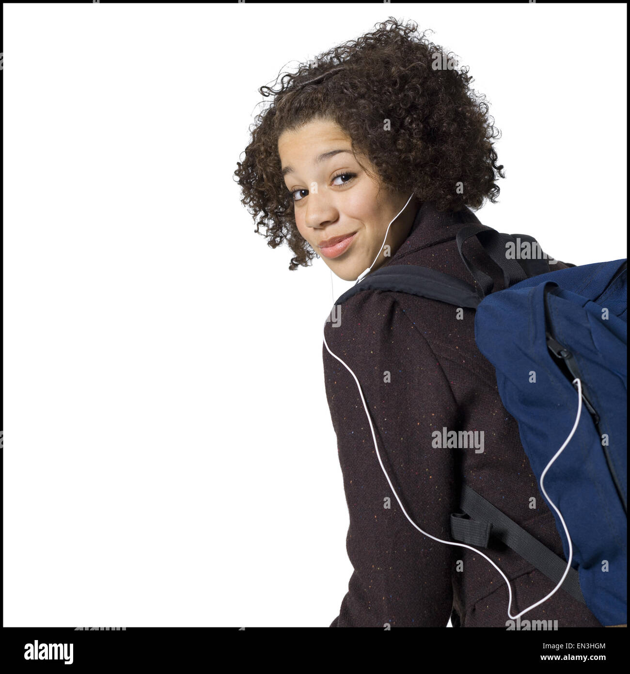 Girl with backpack and earbuds smiling with braces Stock Photo - Alamy