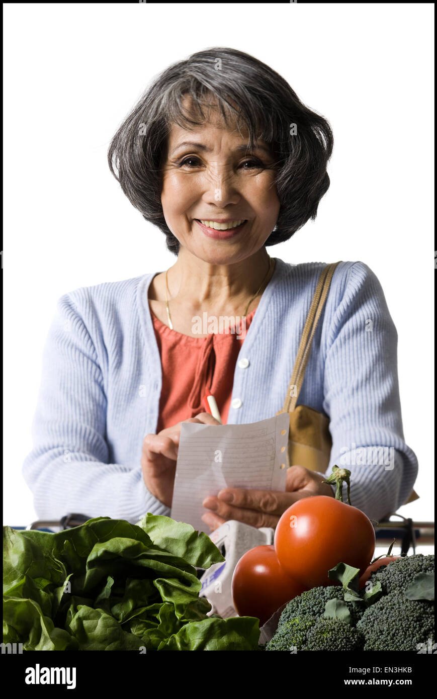 woman looking at a shopping list Stock Photo - Alamy