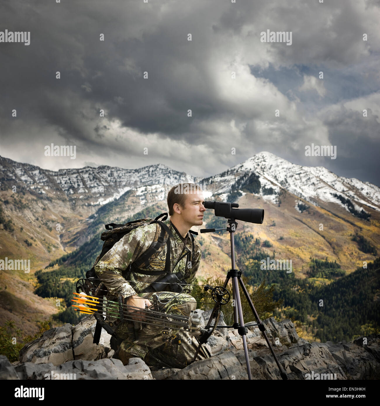 hunter using binoculars to spot prey Stock Photo - Alamy
