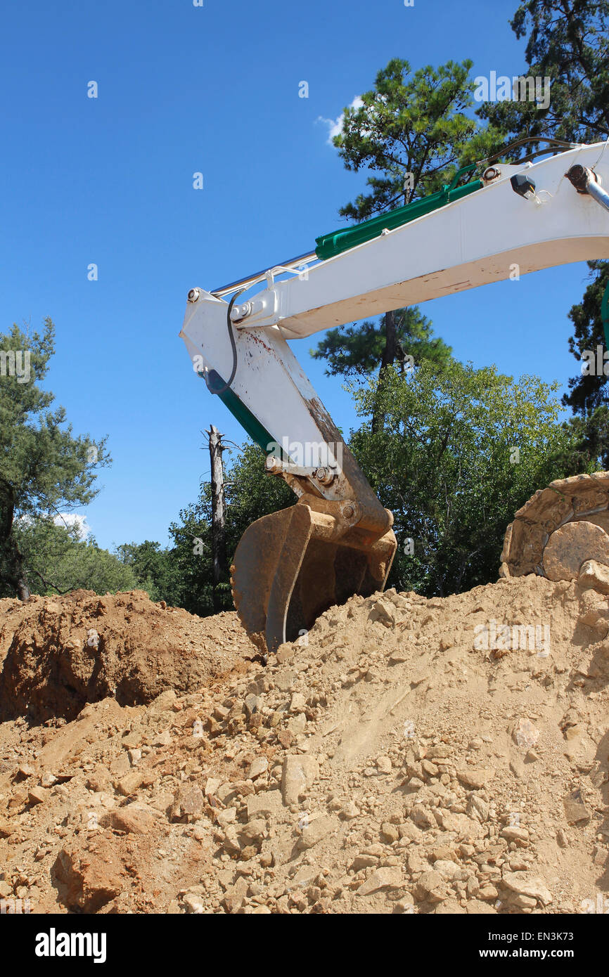 Excavator tractor digging trench hi-res stock photography and images ...