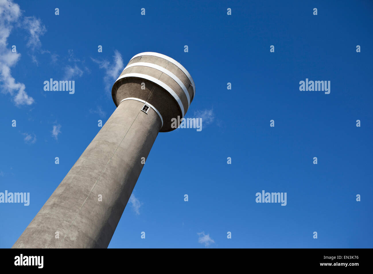 Vintage water tower and blue sky on background Stock Photo - Alamy