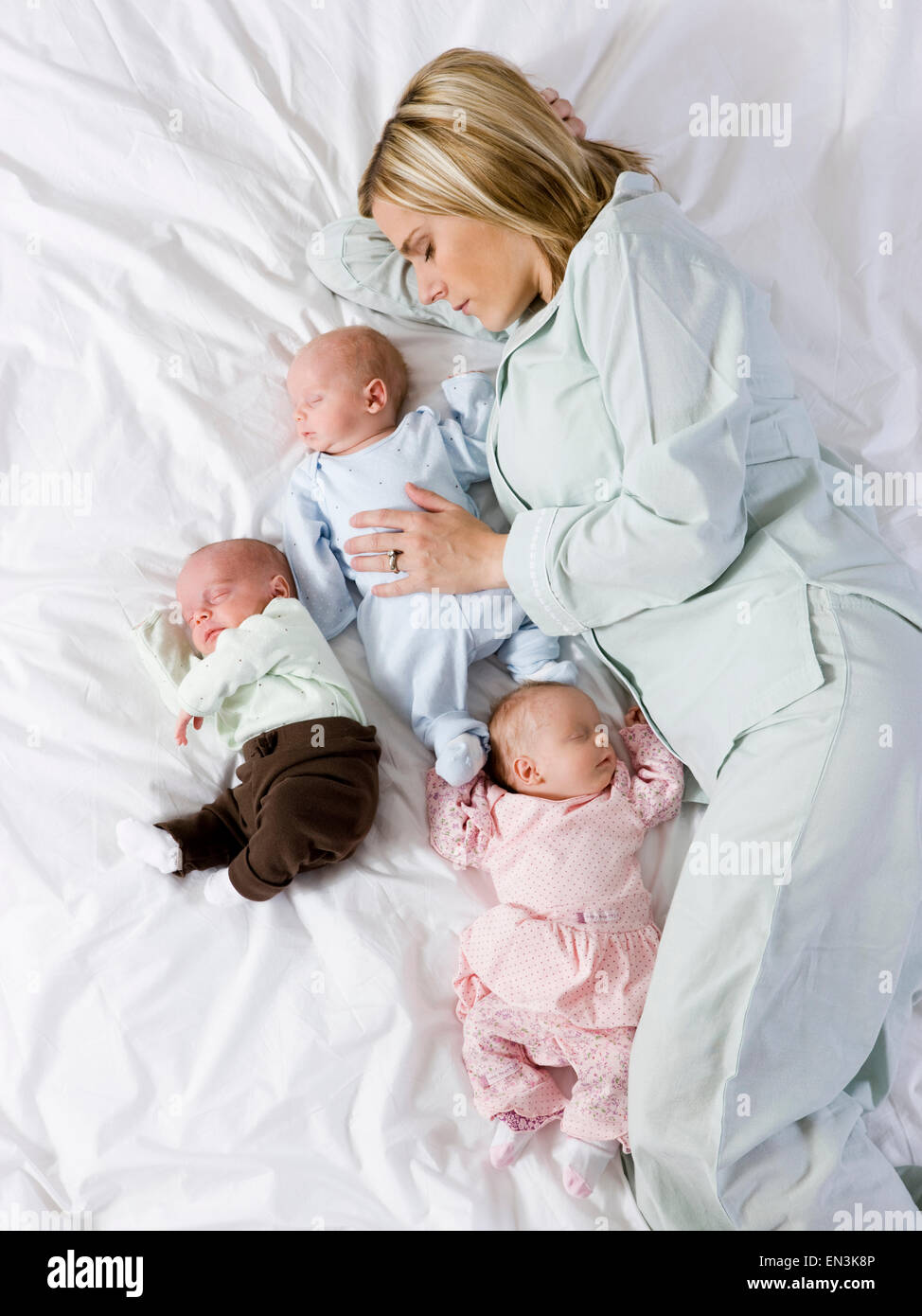 mother with newborn triplets Stock Photo - Alamy