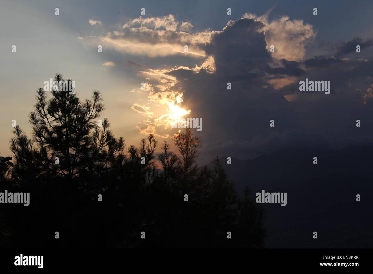 Sunset through clouds Turkey Stock Photo - Alamy