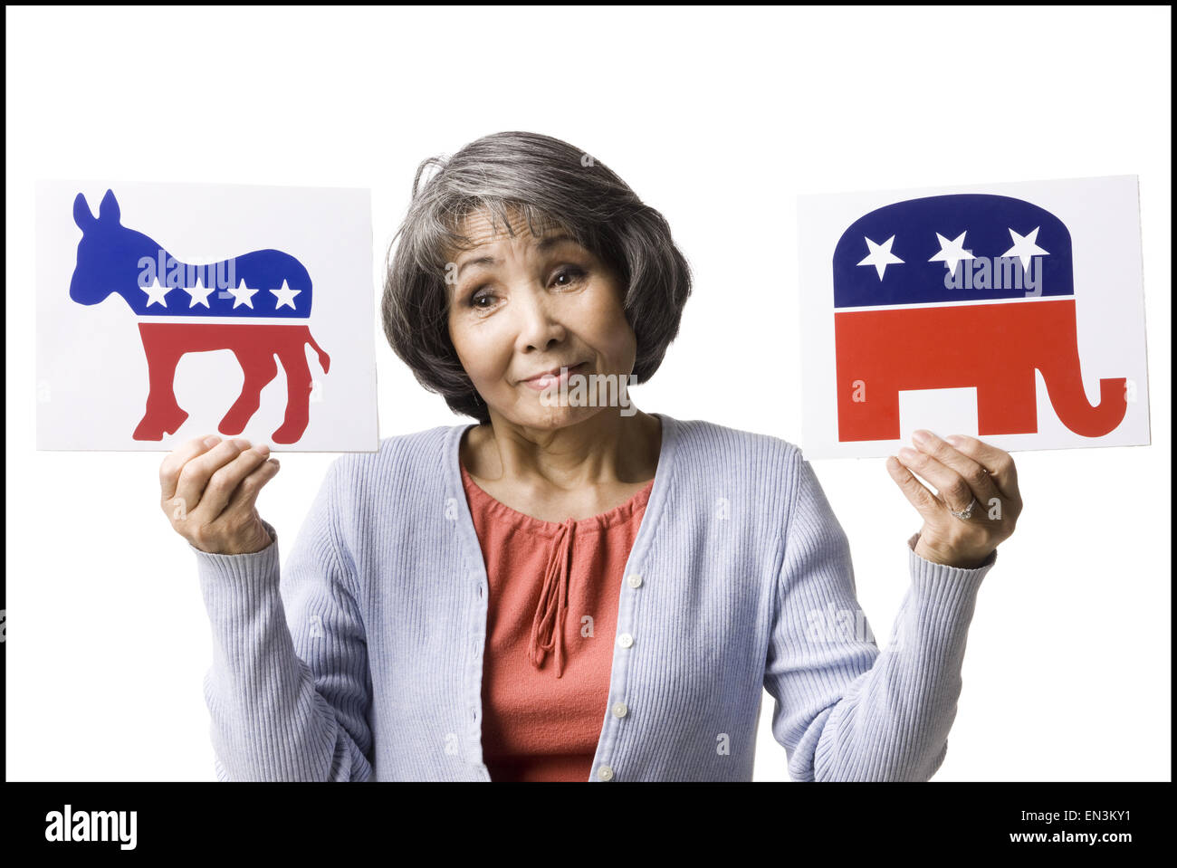 woman holding up political party signs Stock Photo - Alamy