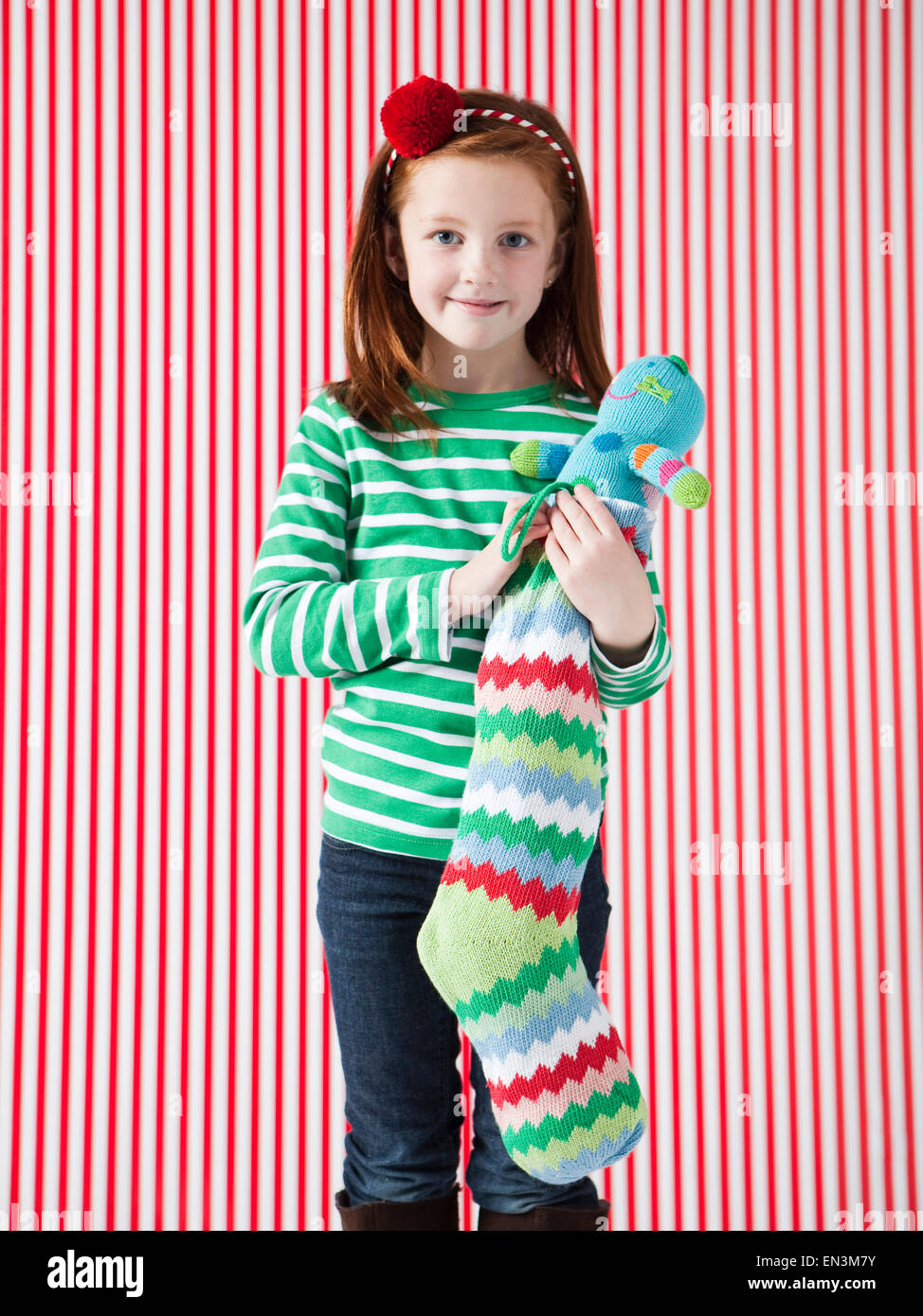 Studio portrait of girl (4-5) holding Christmas stocking Stock Photo ...