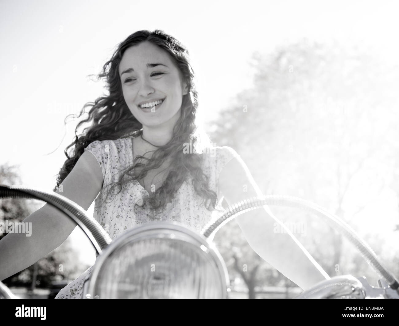 Young woman driving motorcycle Stock Photo - Alamy