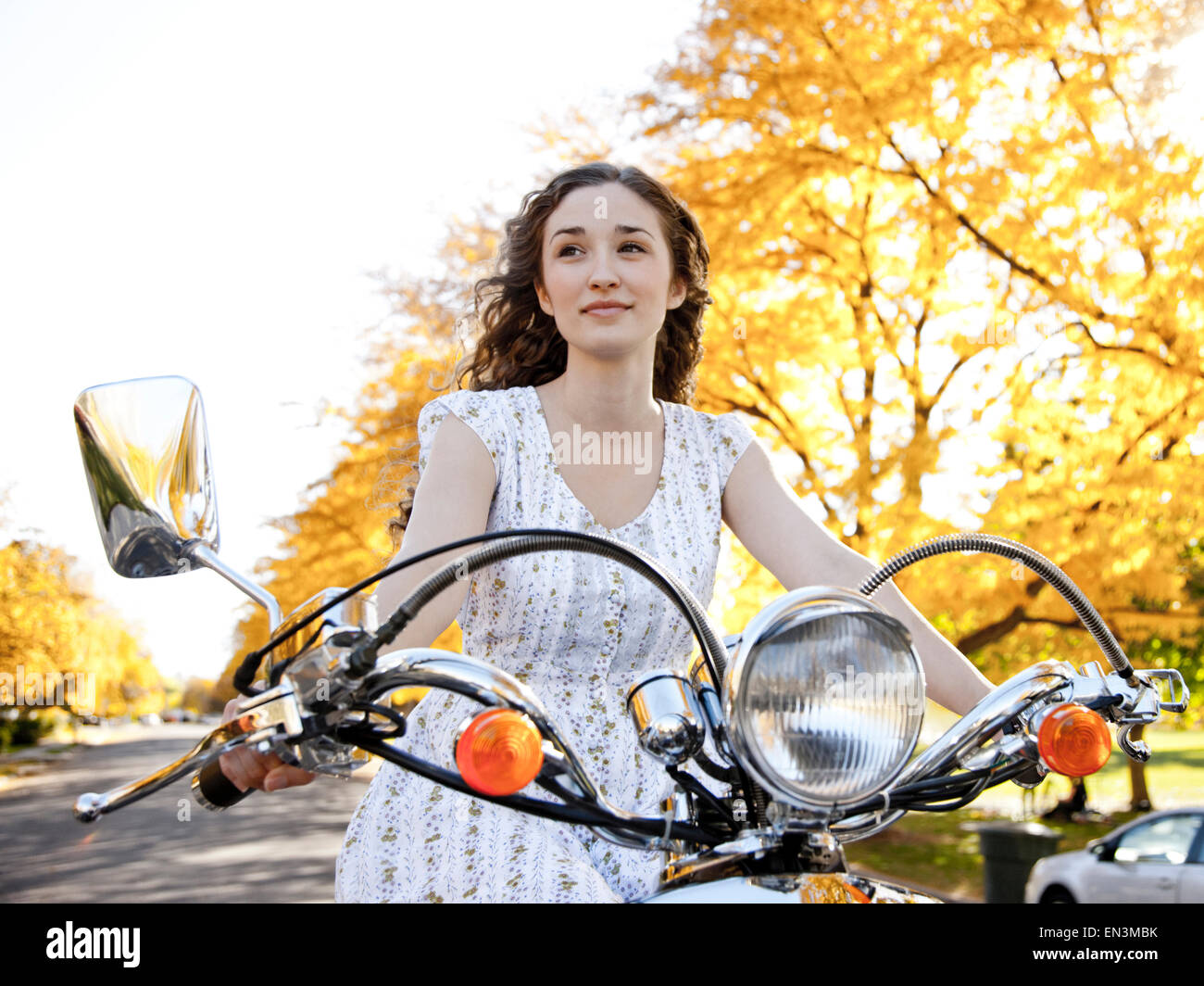 Young woman driving motorcycle Stock Photo - Alamy