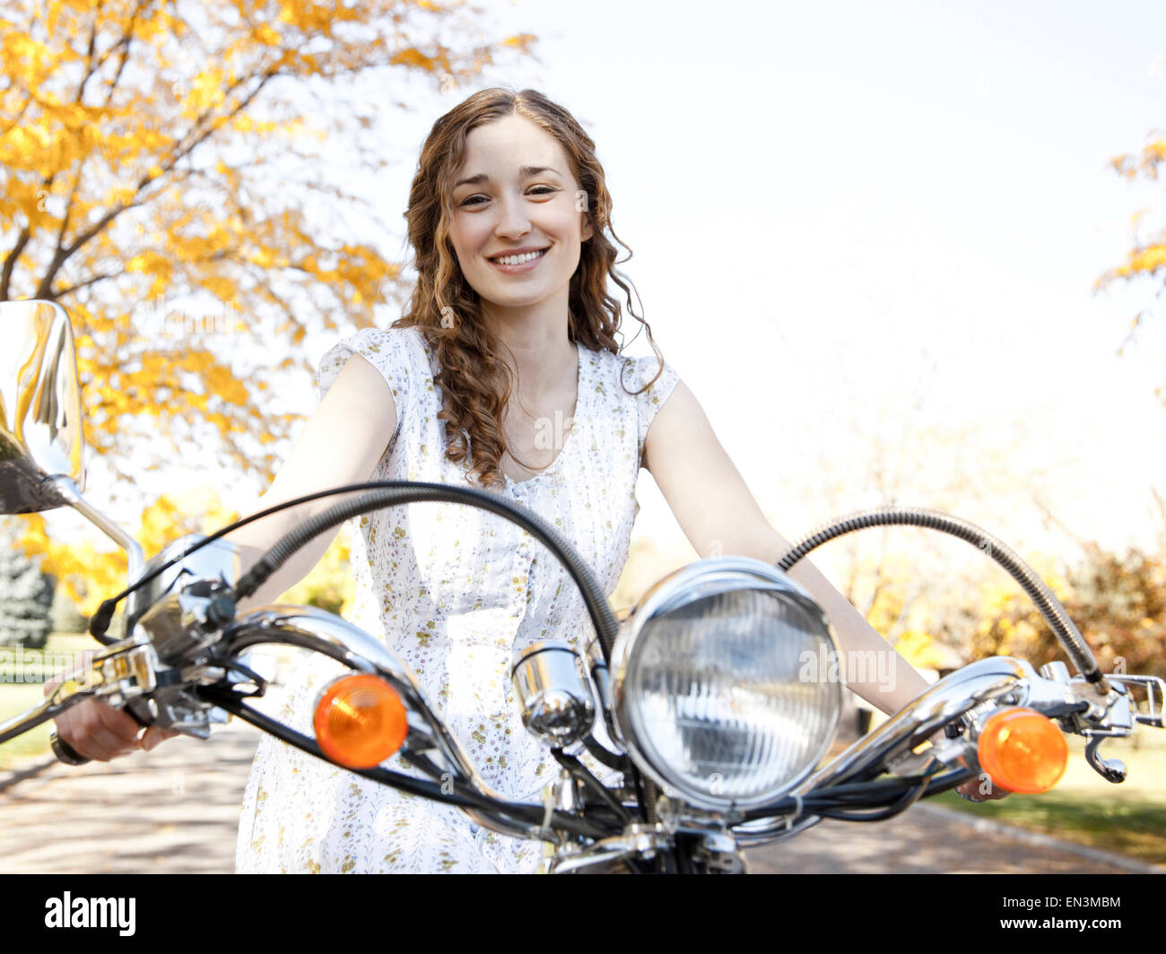 Young woman driving motorcycle Stock Photo - Alamy