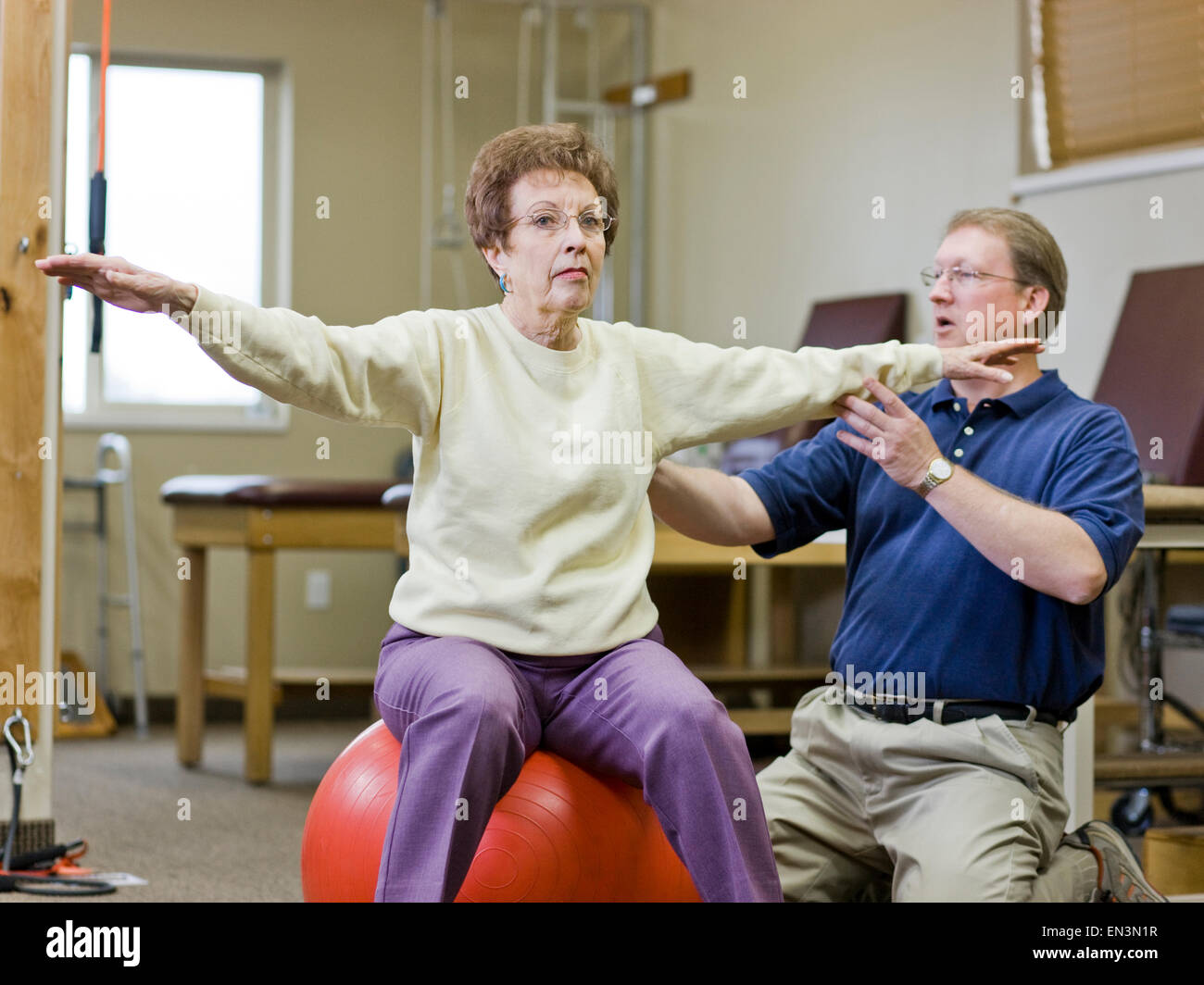 physical therapist working with a woman Stock Photo - Alamy