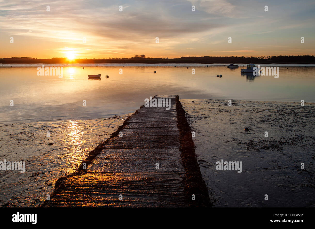 Boats at moorings at sunset on the River Deben, Ramsholt, Suffolk ...