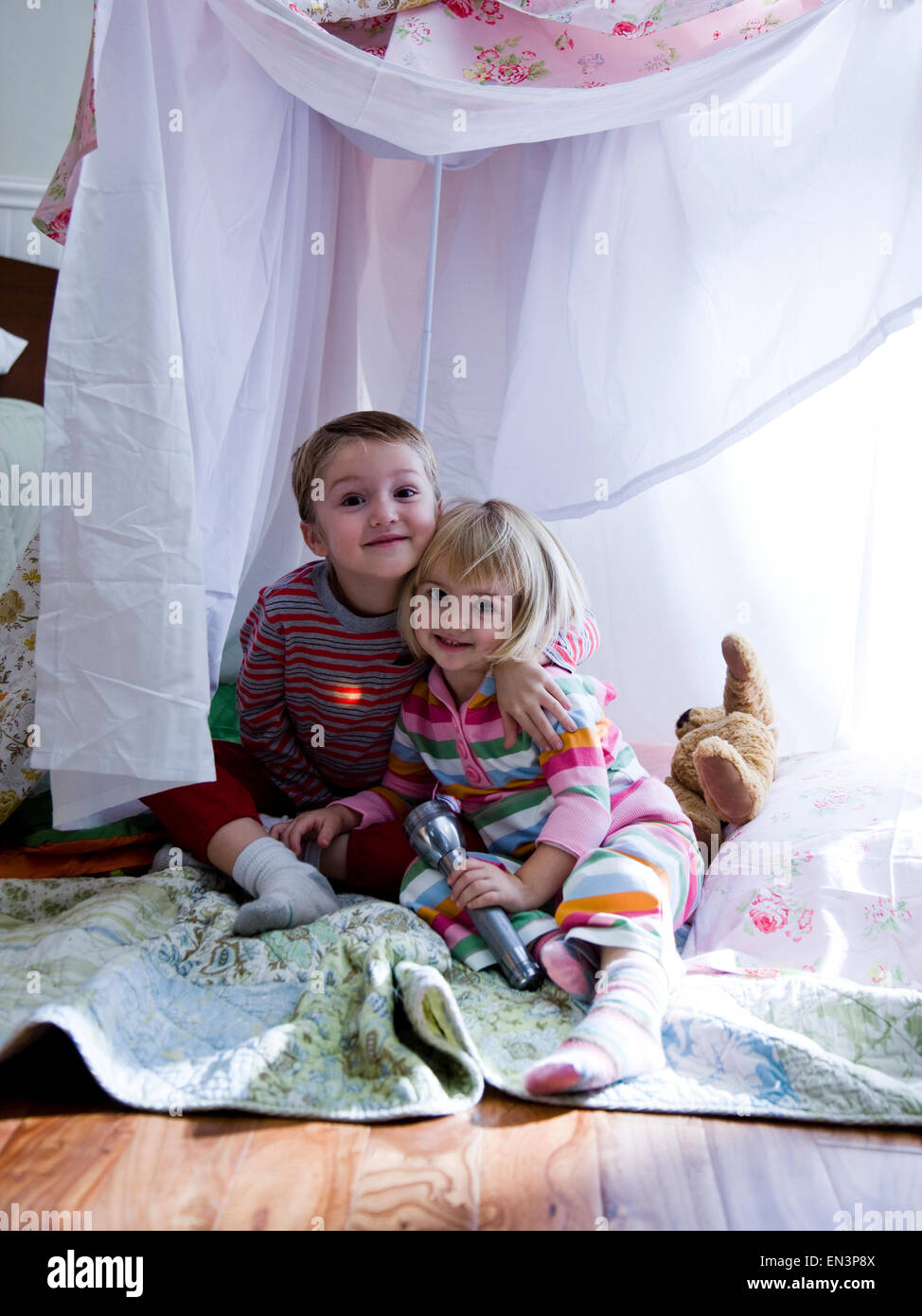 brother and sister in a makeshift fort Stock Photo - Alamy