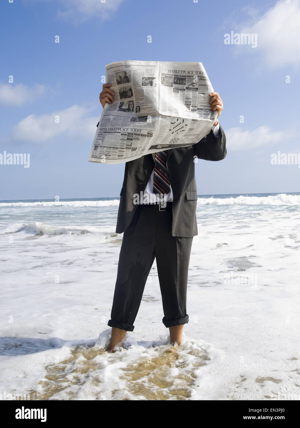 Businessman standing in water with newspaper outdoors Stock Photo - Alamy
