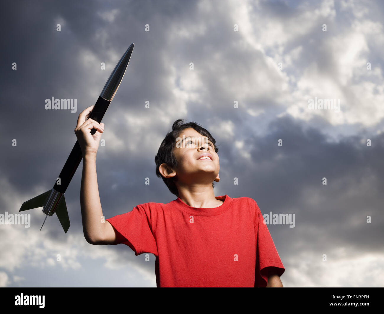Boy playing with toy rocket outdoors Stock Photo - Alamy