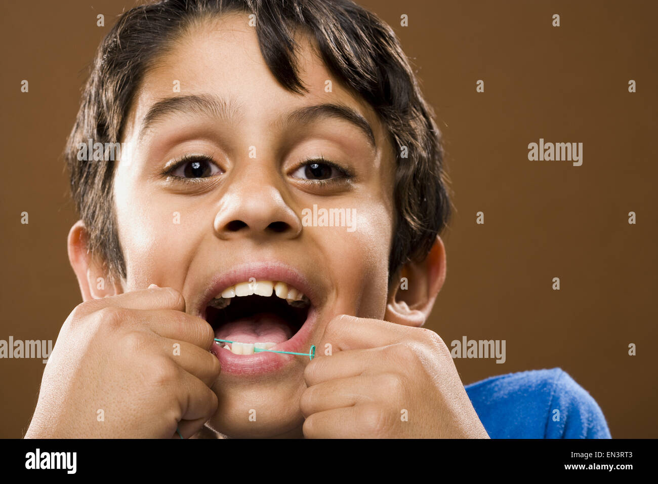 Closeup of boy flossing teeth Stock Photo - Alamy