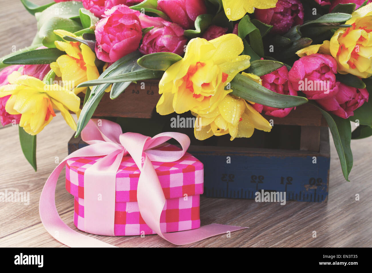 spring flowers with gift box Stock Photo - Alamy