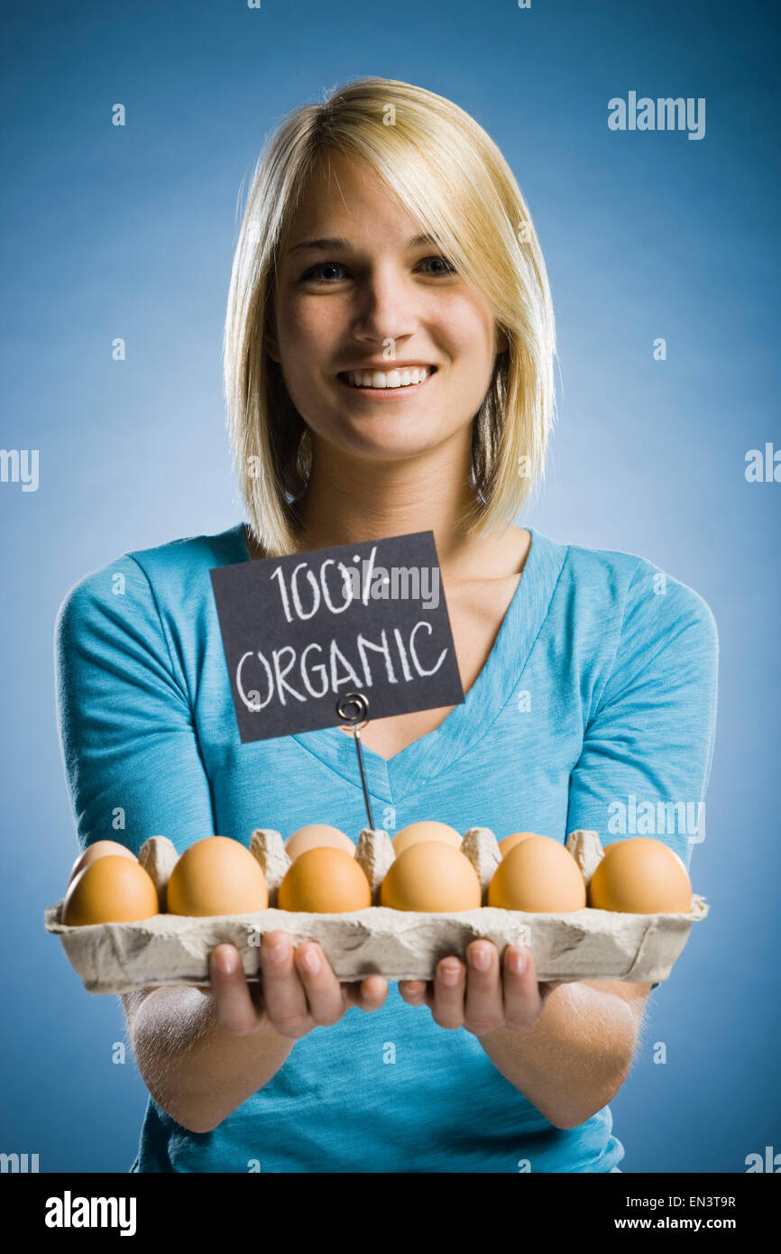 woman holding organic eggs Stock Photo - Alamy