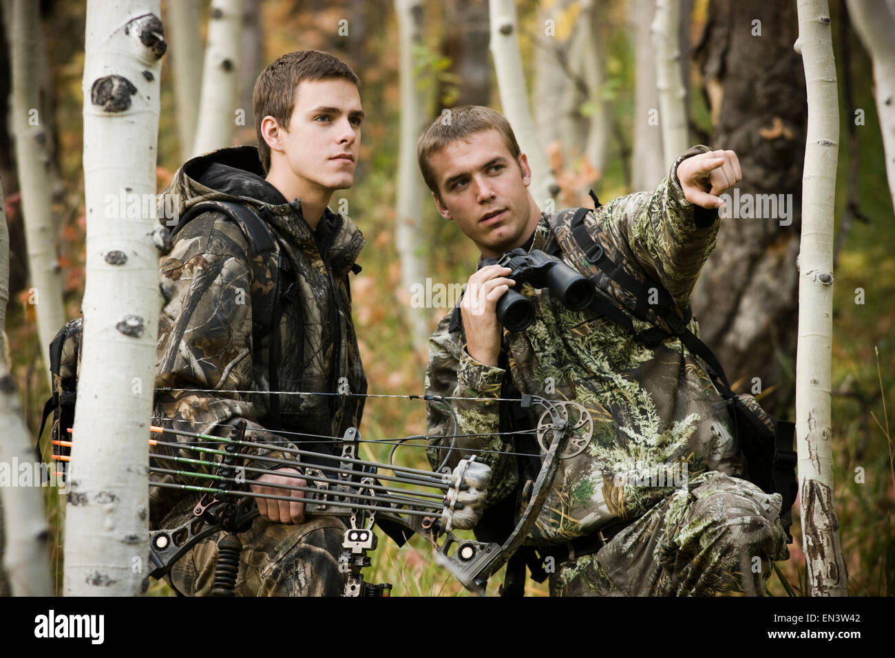 two men hunting in the wilderness Stock Photo - Alamy