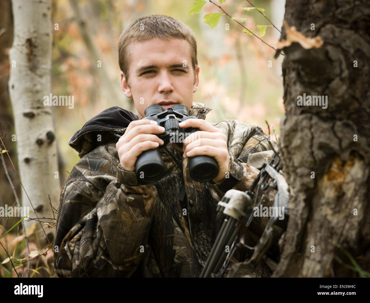 man hunting in the wilderness Stock Photo - Alamy