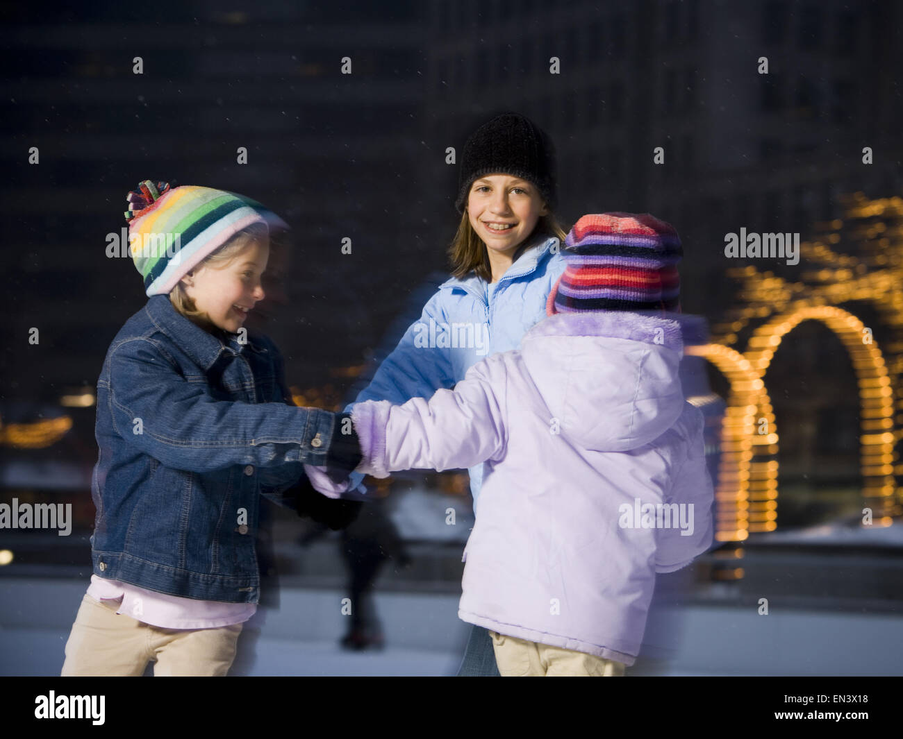 Three girls outdoors in winter Stock Photo - Alamy