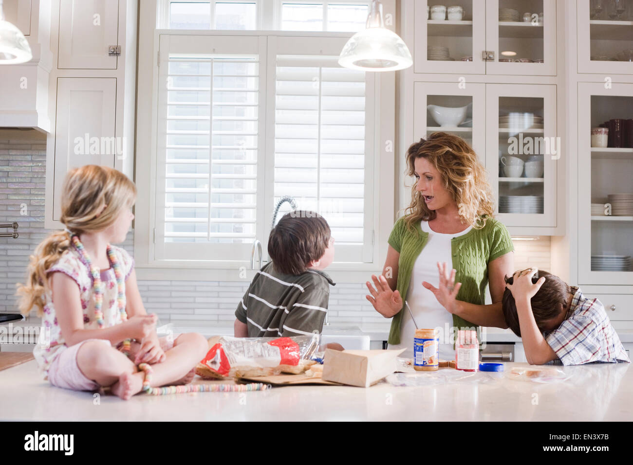 mother and children in the kitchen Stock Photo - Alamy
