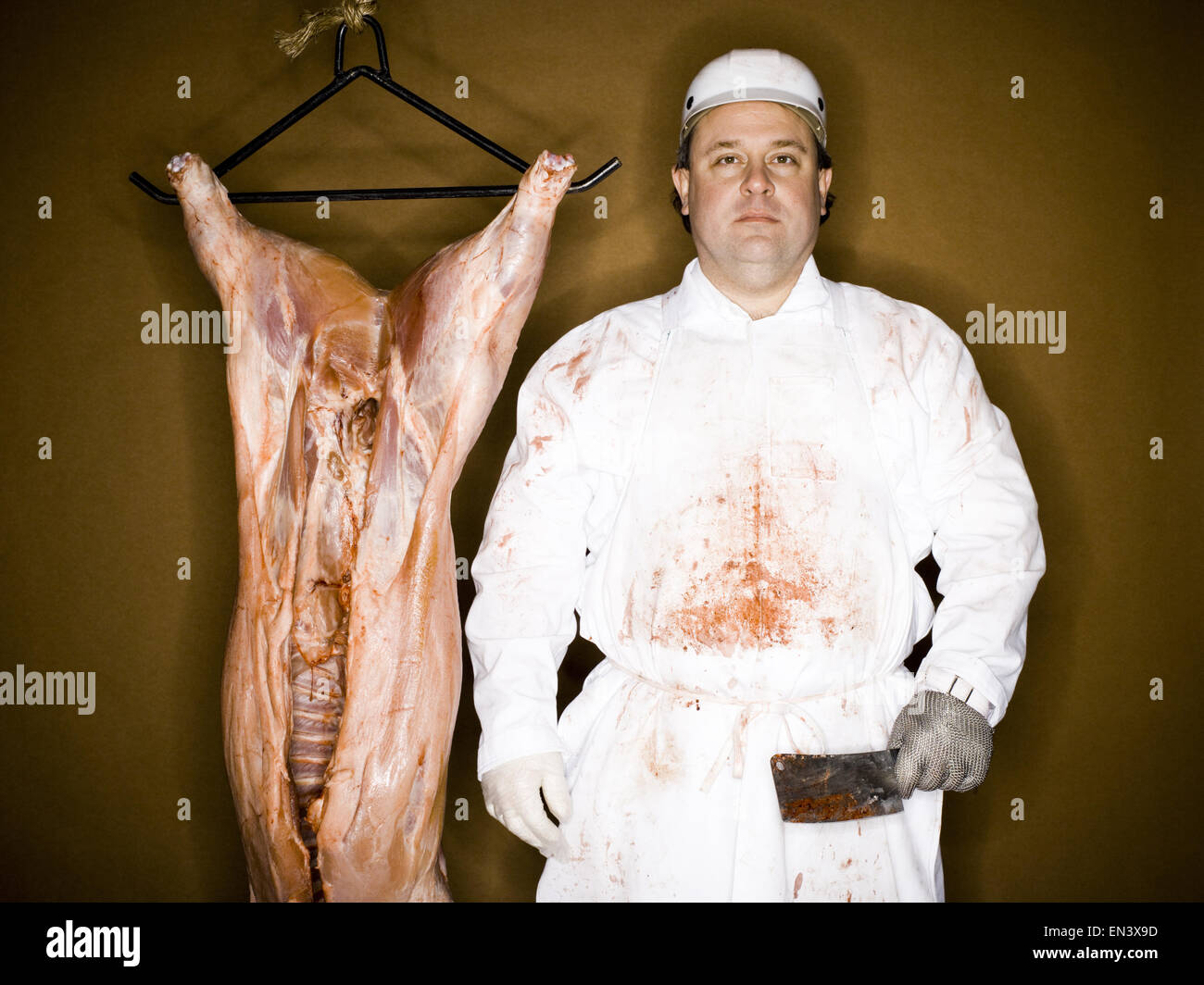 Butcher standing hanging carcass knife hi-res stock photography and ...