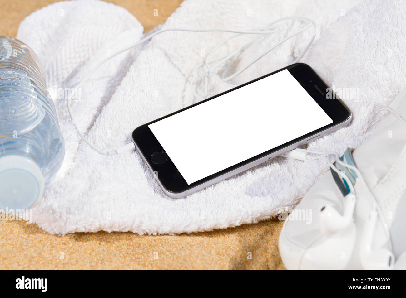 white sneakers in sand Stock Photo - Alamy