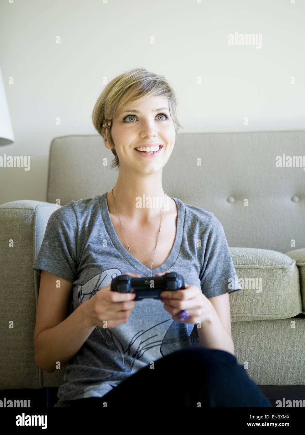 Blonde joystick holding game hi-res stock photography and images - Alamy