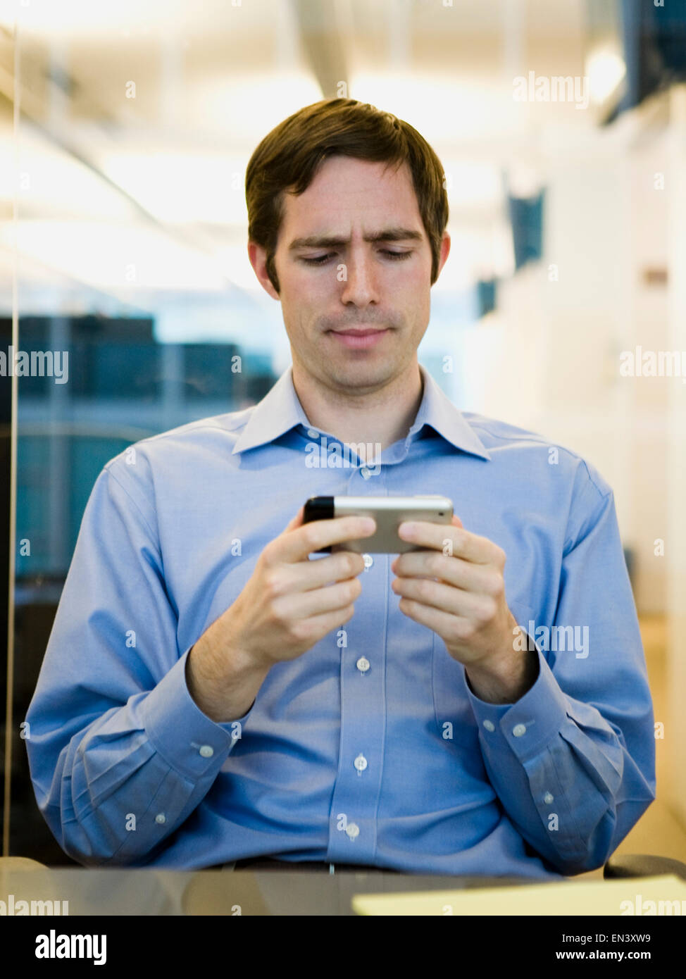 man in a blue shirt at work Stock Photo - Alamy