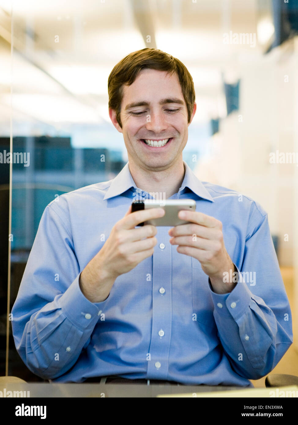 man in a blue shirt at work Stock Photo - Alamy