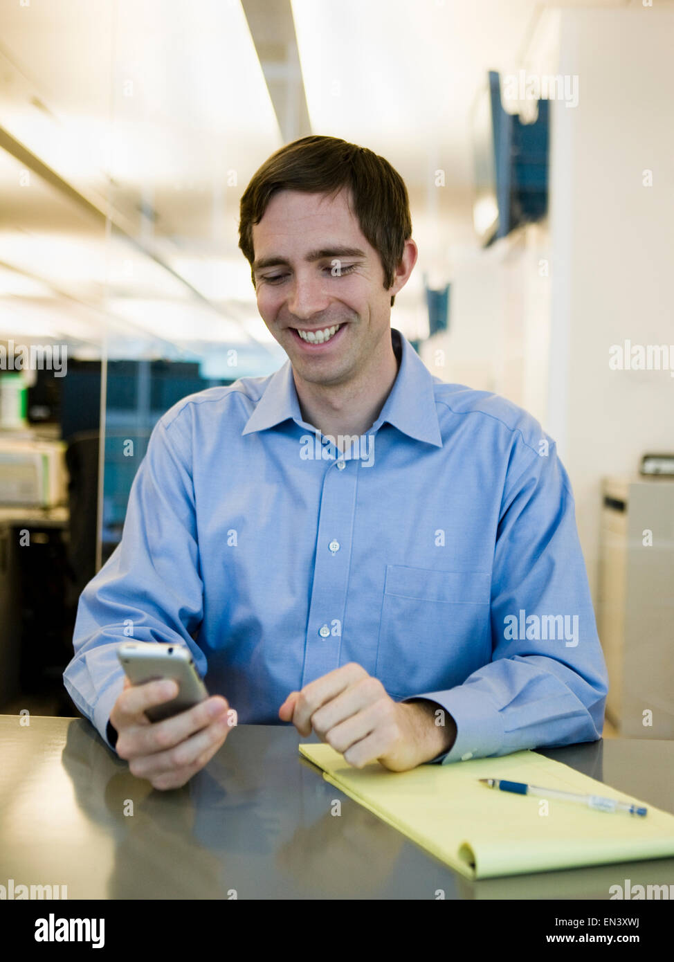 man in a blue shirt at work Stock Photo - Alamy