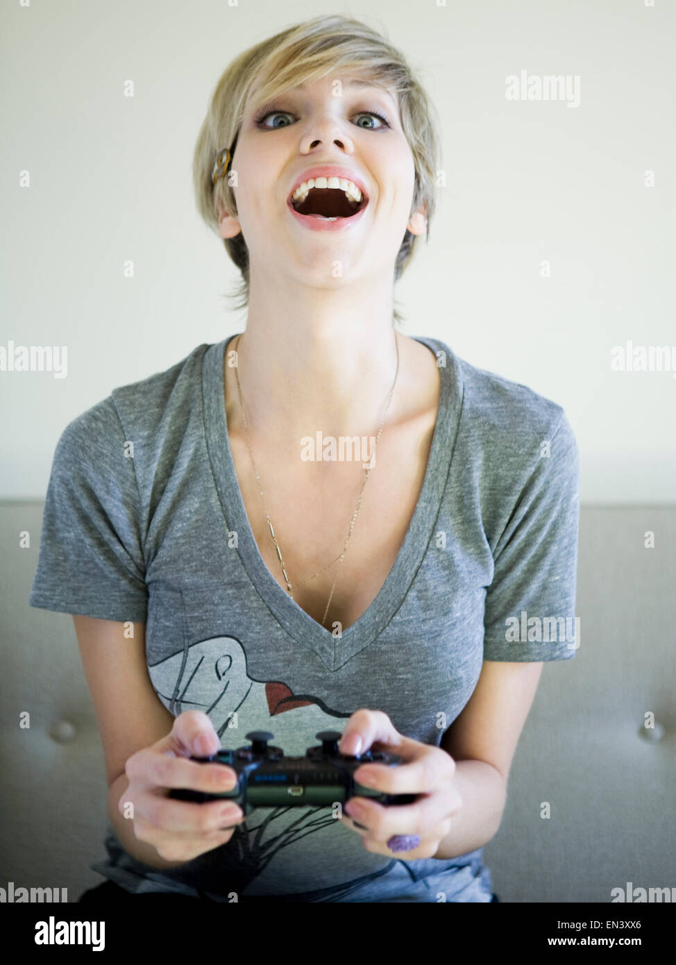 Blonde joystick holding game hi-res stock photography and images - Alamy