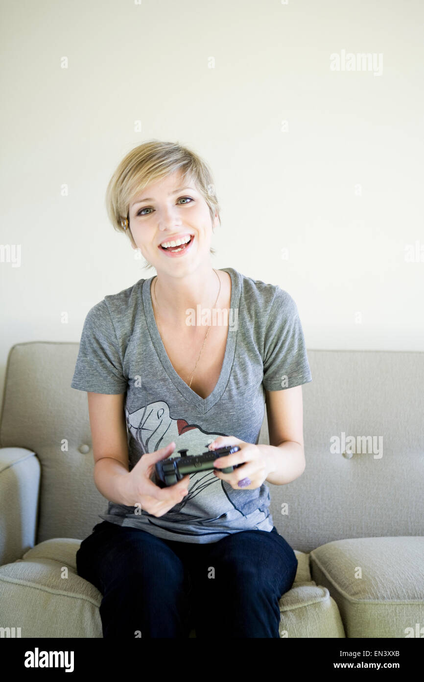woman holding a video game controller Stock Photo - Alamy