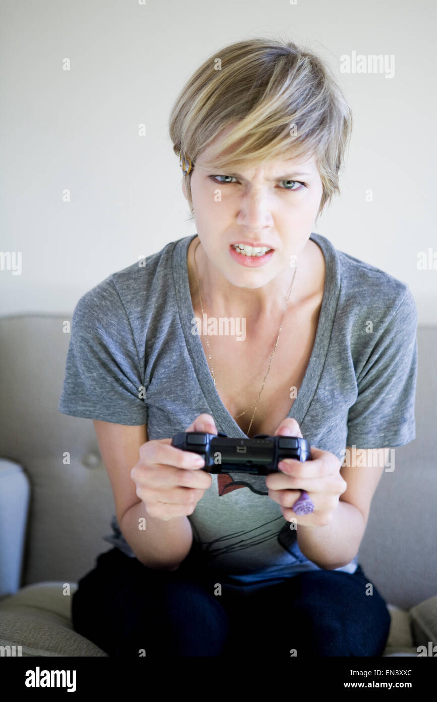 Blonde joystick holding game hi-res stock photography and images - Alamy