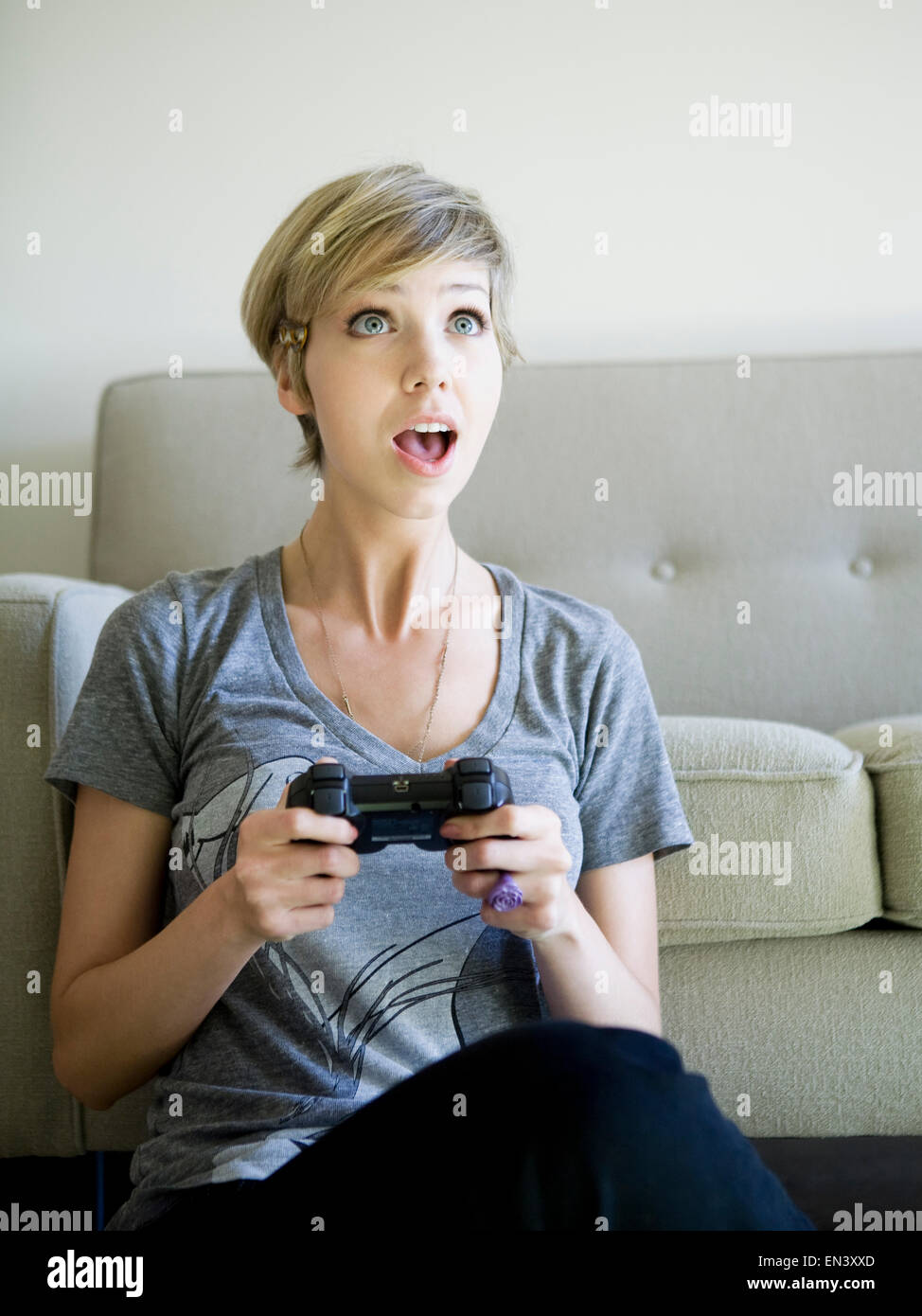 woman holding a video game controller Stock Photo - Alamy