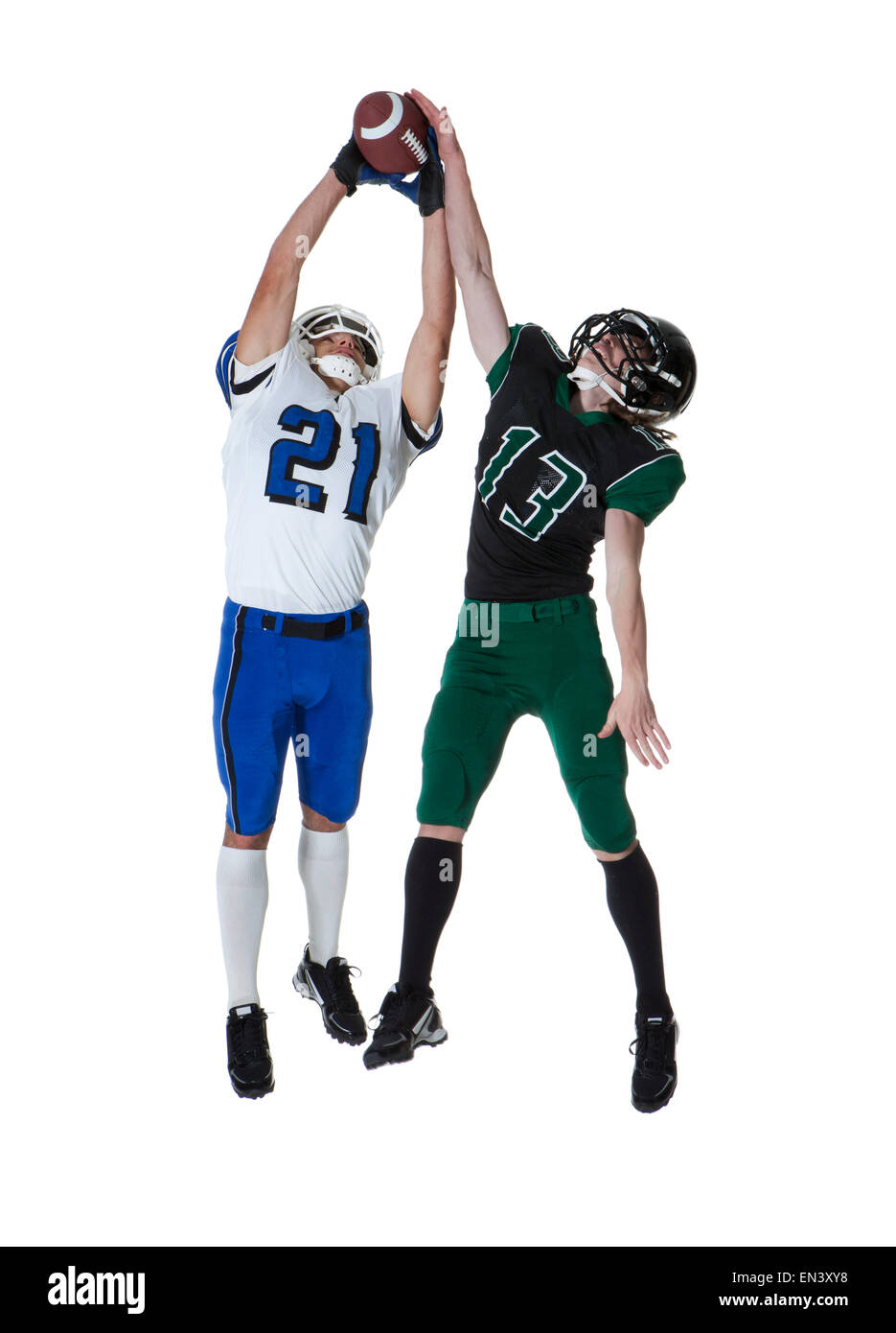 Two male players of American football catching ball, studio shot Stock ...