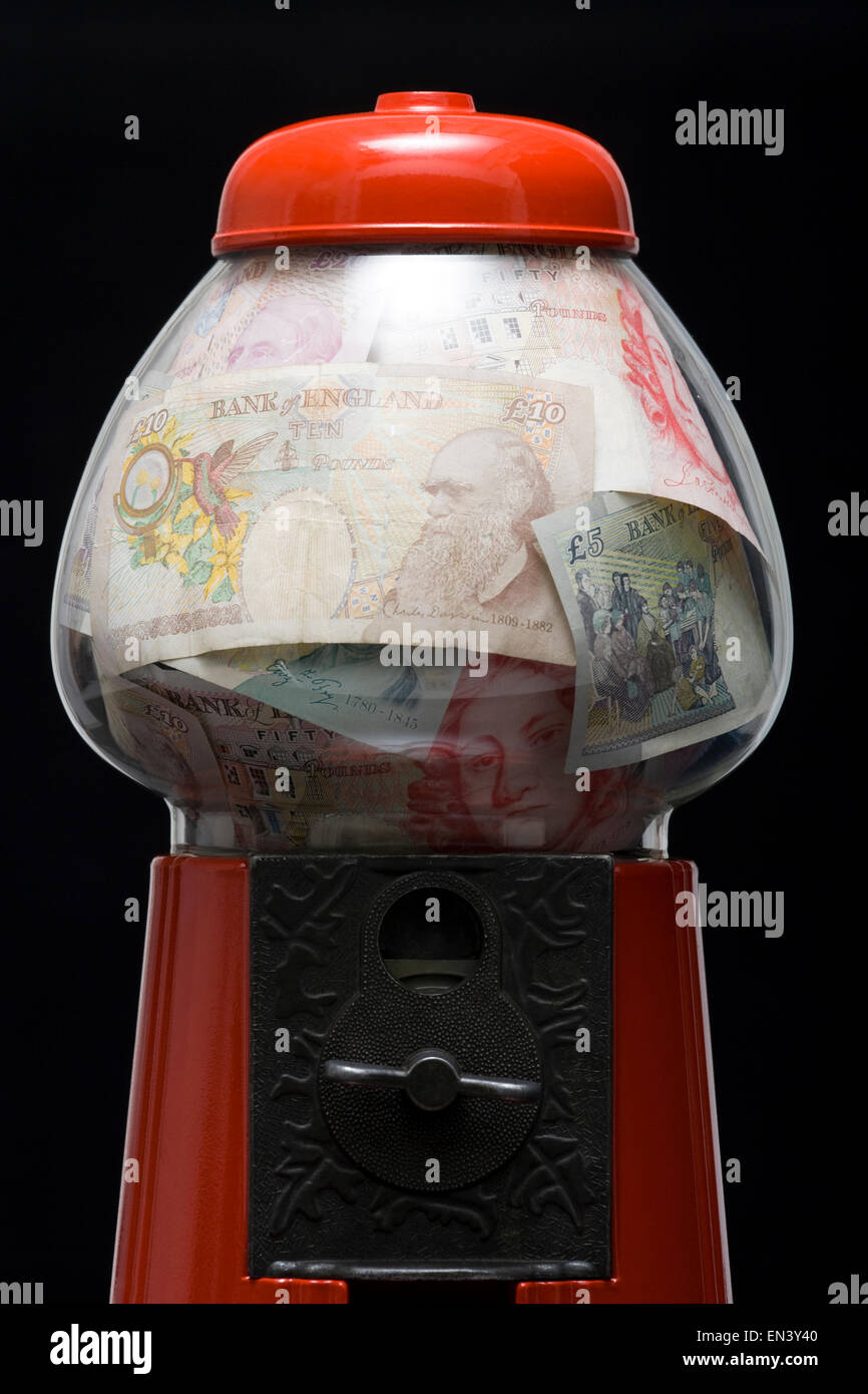 gumball machine full of money Stock Photo - Alamy