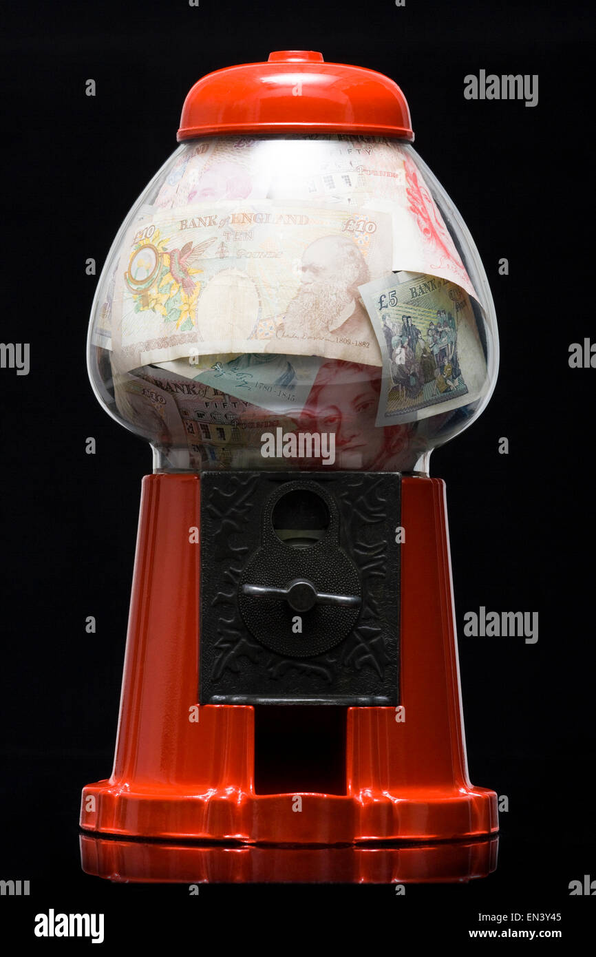 gumball machine full of money Stock Photo - Alamy