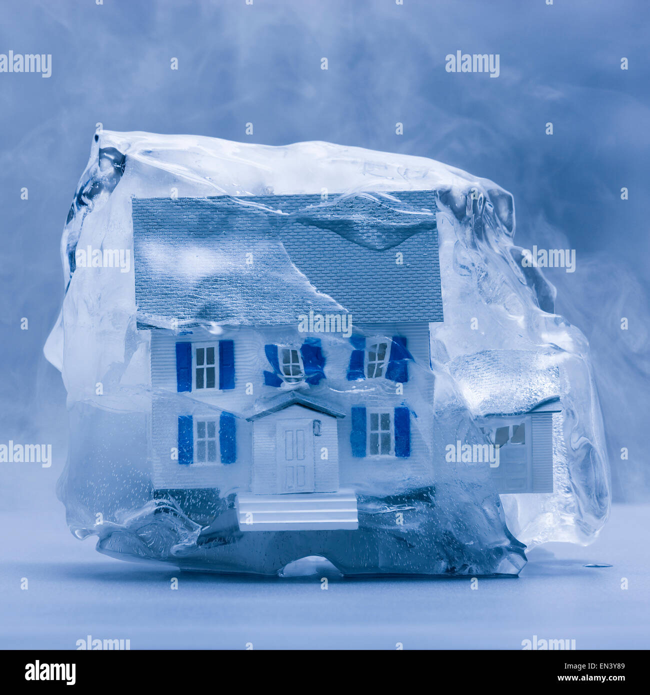 house frozen in a block of ice Stock Photo - Alamy