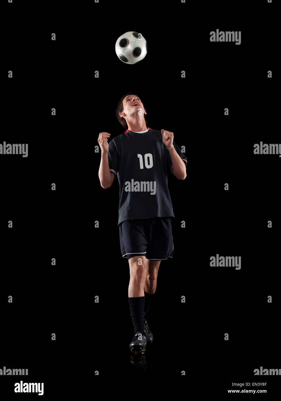 Boys football heading ball hi-res stock photography and images - Alamy