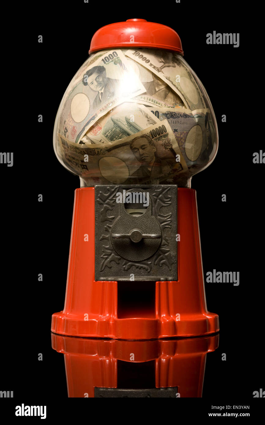 gumball machine full of money Stock Photo - Alamy