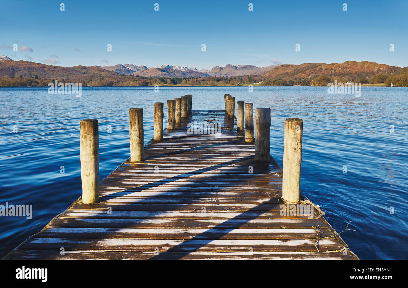 A jetty at Ambleside in the lake district, UK, bathed in winter ...