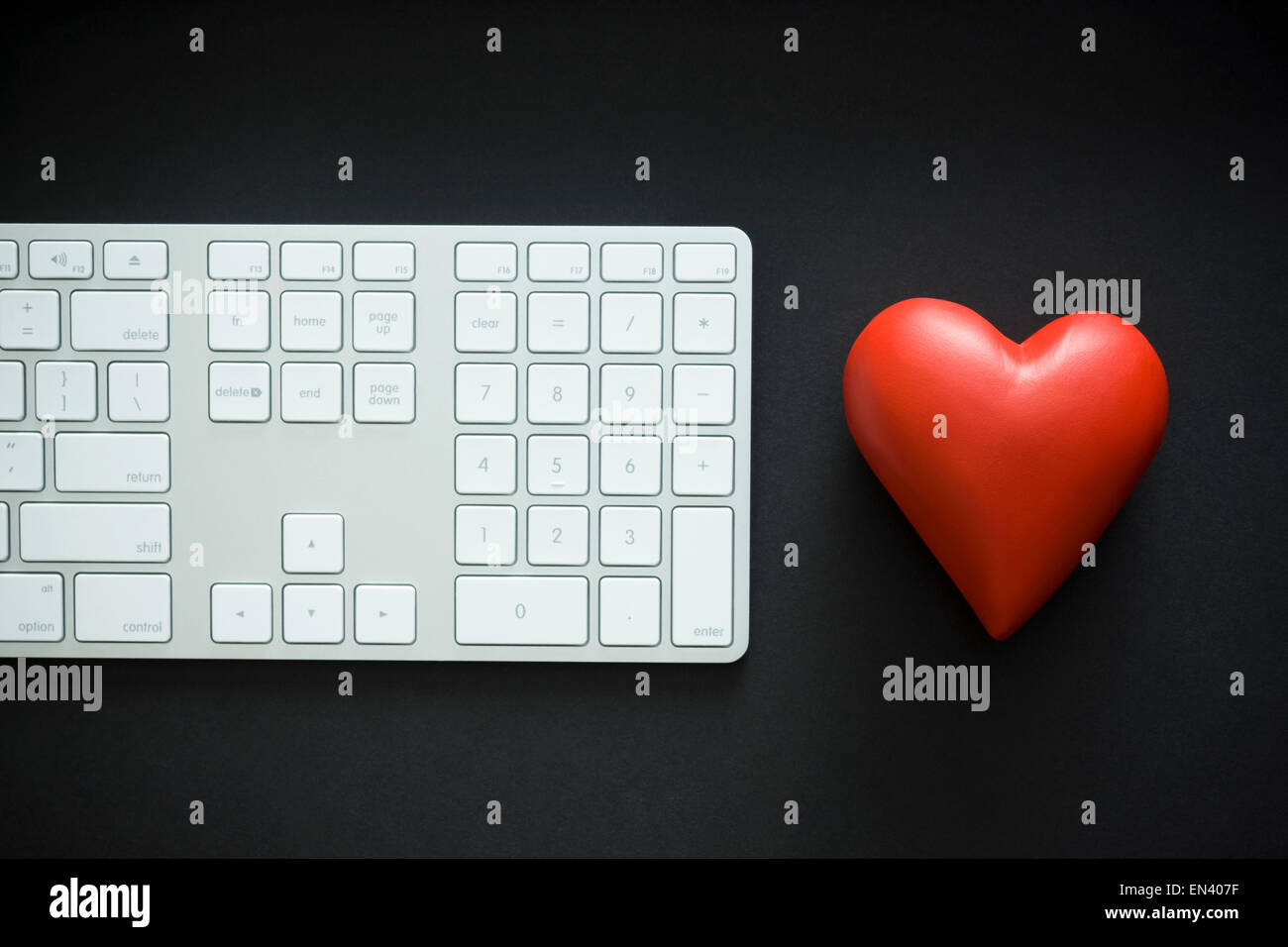 heart next to a keyboard Stock Photo - Alamy