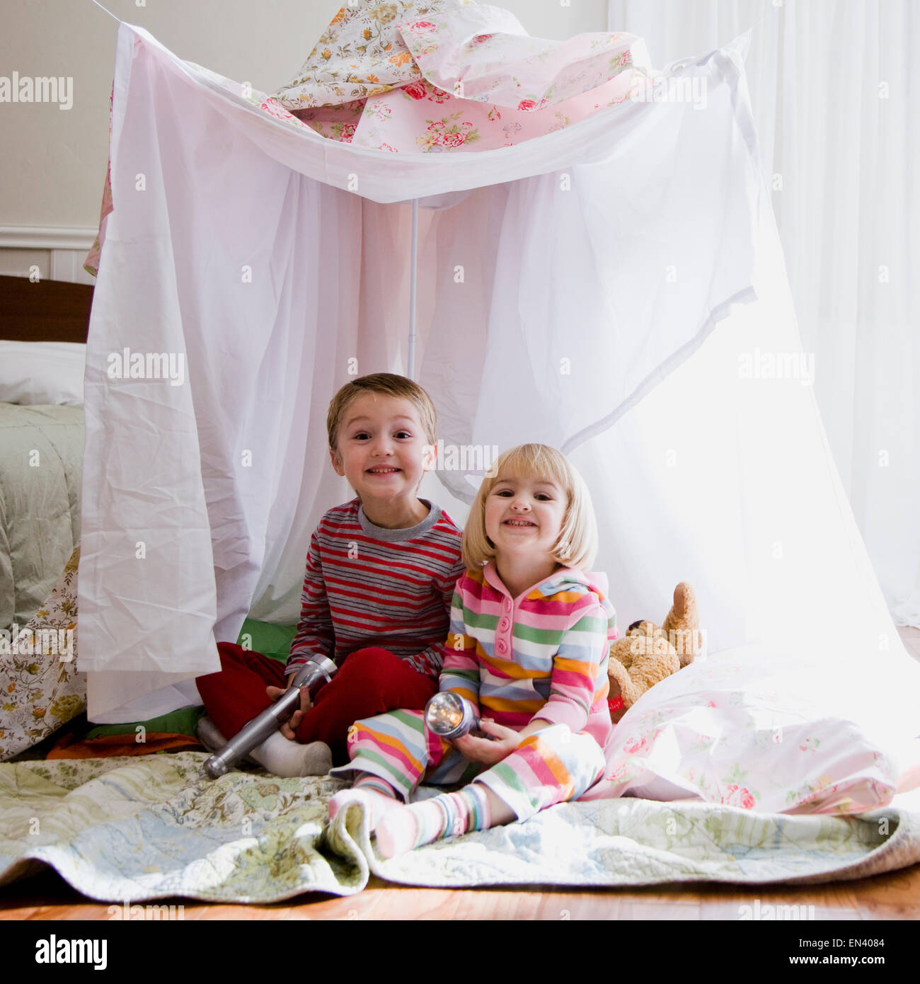brother and sister in a makeshift fort Stock Photo - Alamy