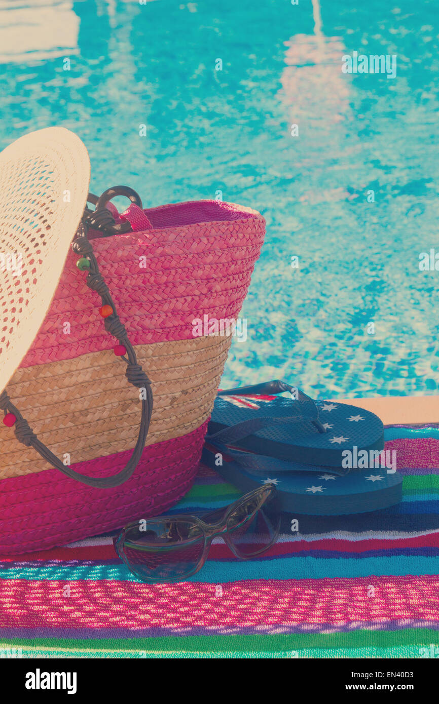 towel and bathing accessories near pool Stock Photo - Alamy
