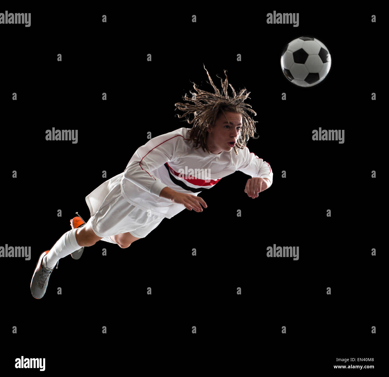 Football player heading ball hi-res stock photography and images - Alamy