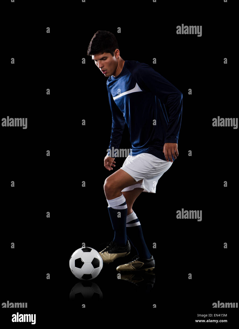 Man playing soccer Stock Photo - Alamy