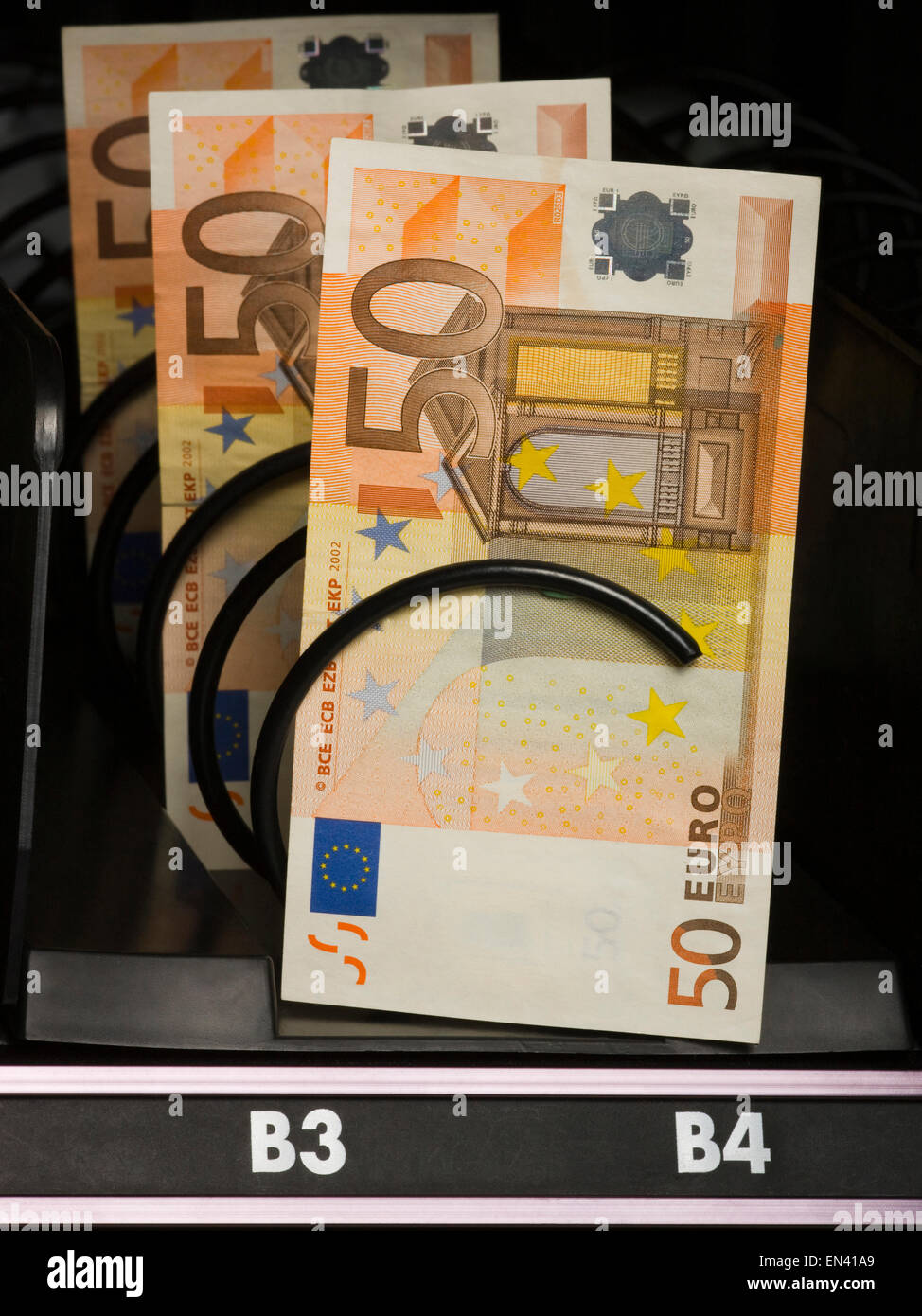 Currency in vending machine hi-res stock photography and images - Alamy
